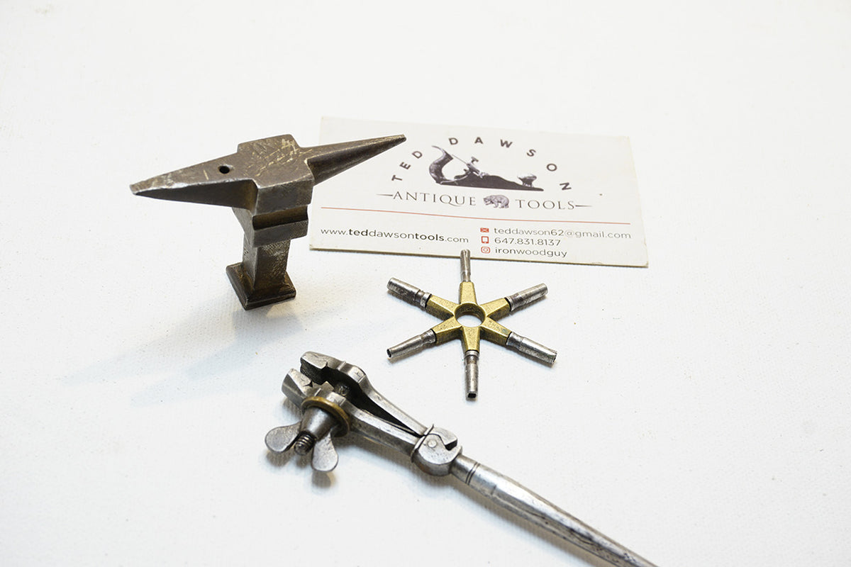EXQUISITE SET OF EARLY JEWELLERS STAKE ANVIL, HAND VISE AND WATCH KEY ...