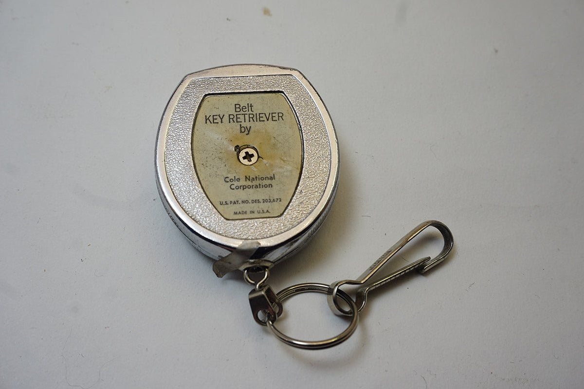 VINTAGE ADVERTISING KEY HOLDER WITH CLIP - COLE NATIONAL CORPORATION ...